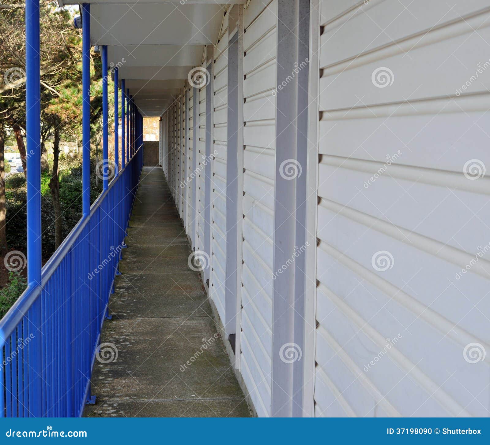 Corridor with Blue Railings Stock Photo - Image of concrete, building ...