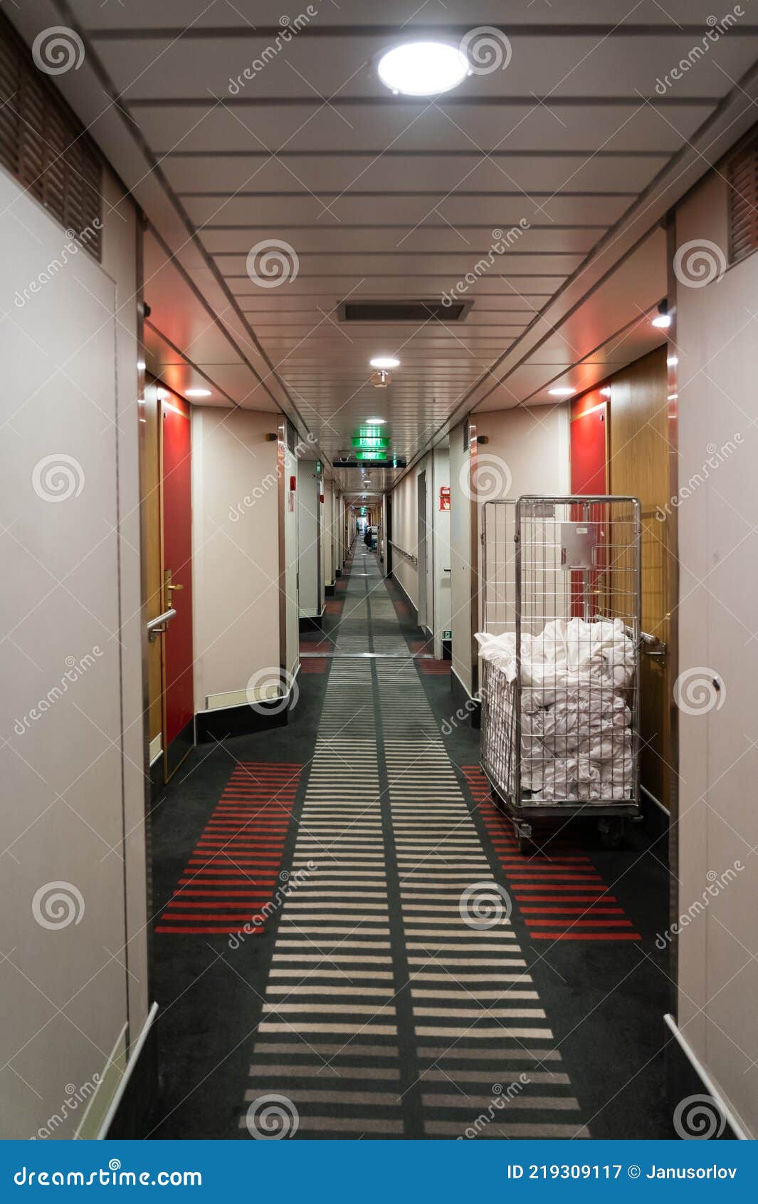 Corridor of a Cruise Ship with Cleaners Changing Towels in the Cabins ...