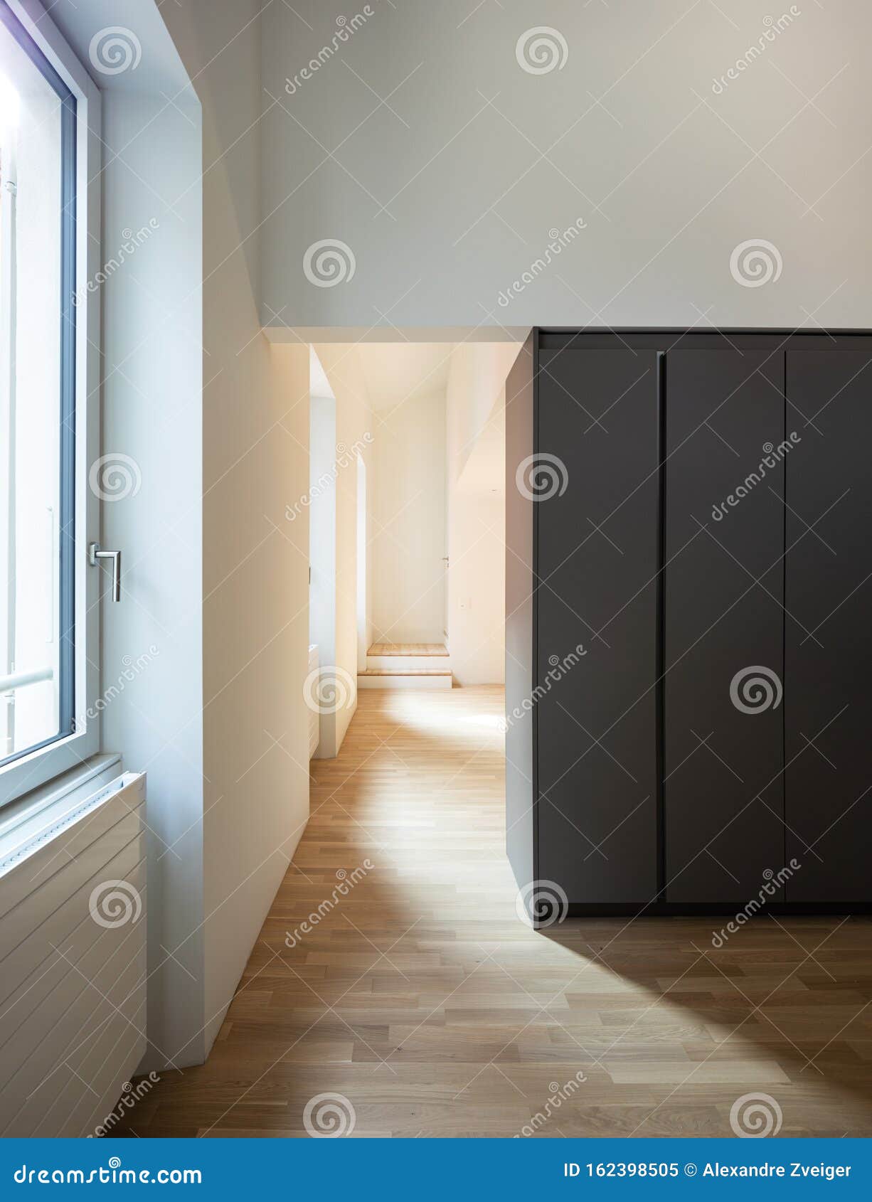 Corridor Front View With White Walls, Wardrobe On The Right And Bright ...