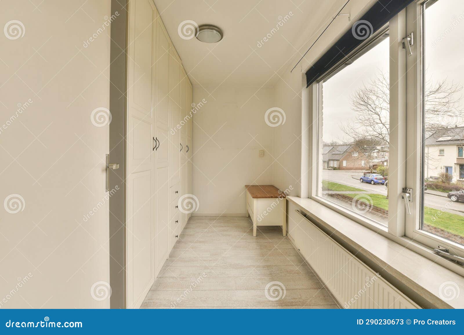 A Corridor with a Large Window and a Small Table Stock Image - Image of ...
