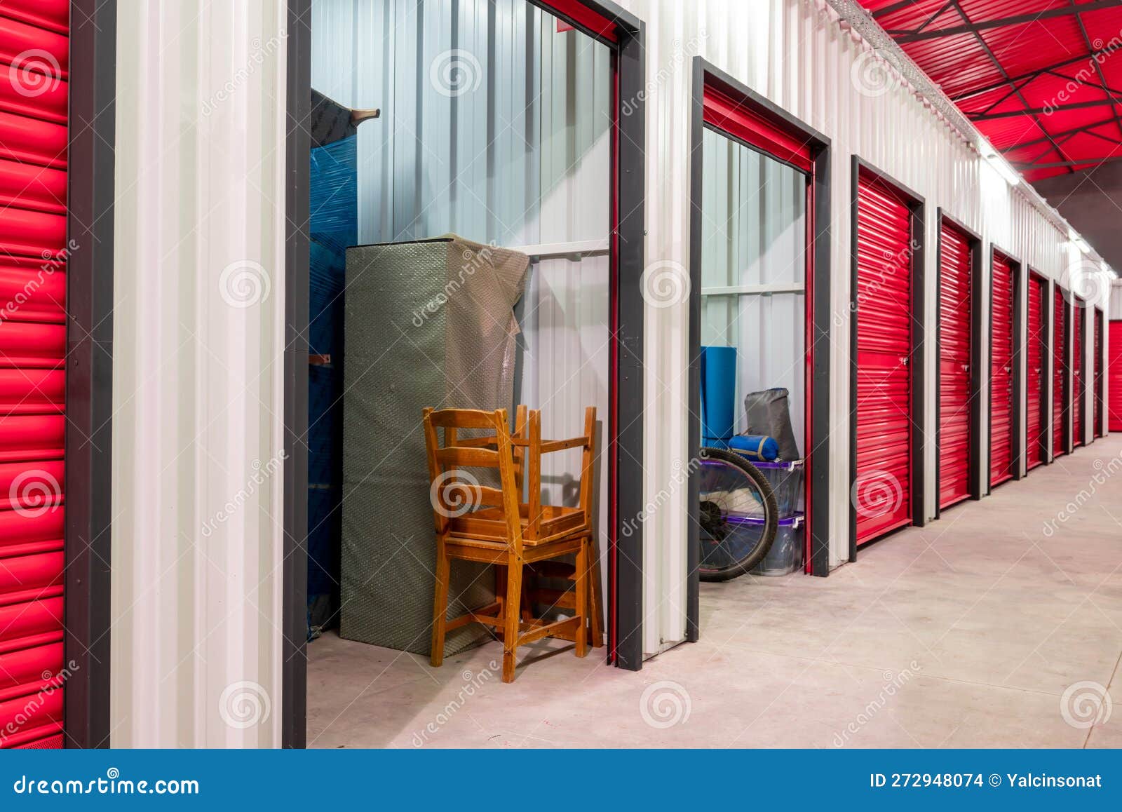 Corridor of Self Storage Unit with Red Doors. Rental Storage Units ...
