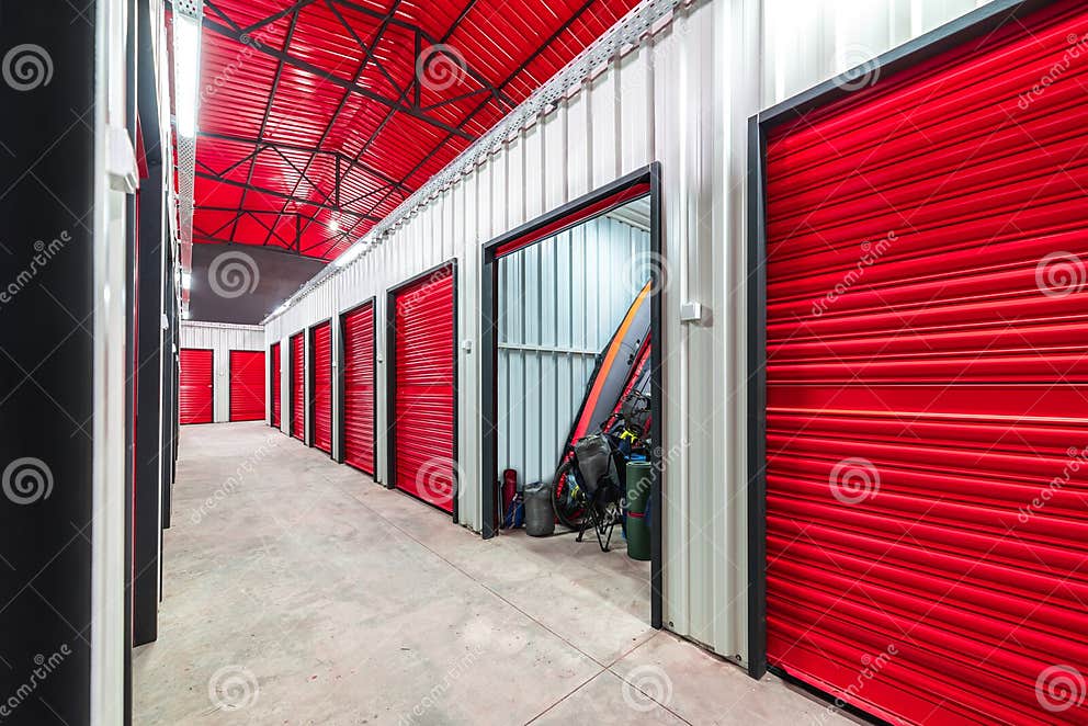 Corridor of Self Storage Unit with Red Doors. Rental Storage Units ...