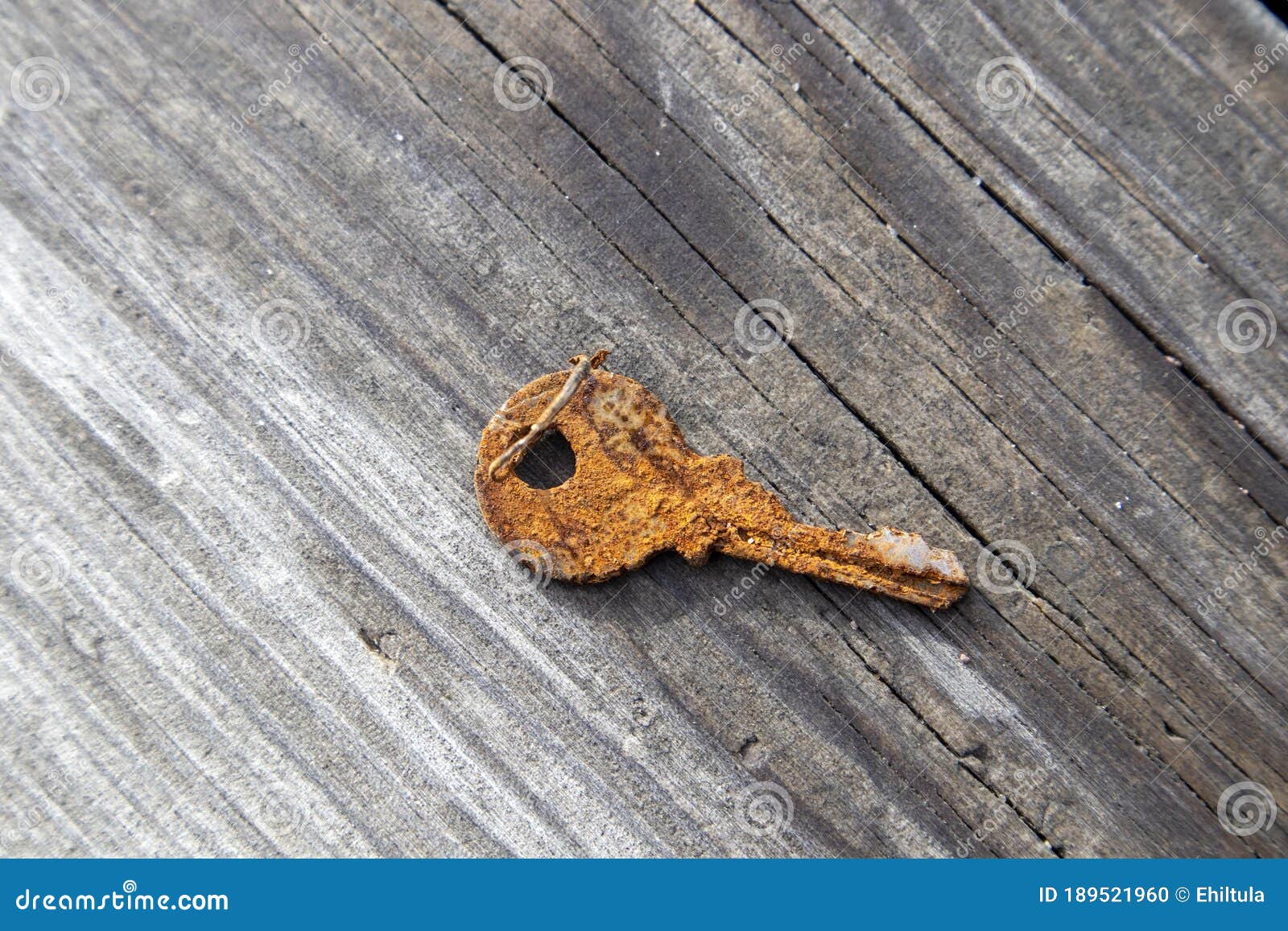 Corroded old key on ground stock photo. Image of rustic - 189521960