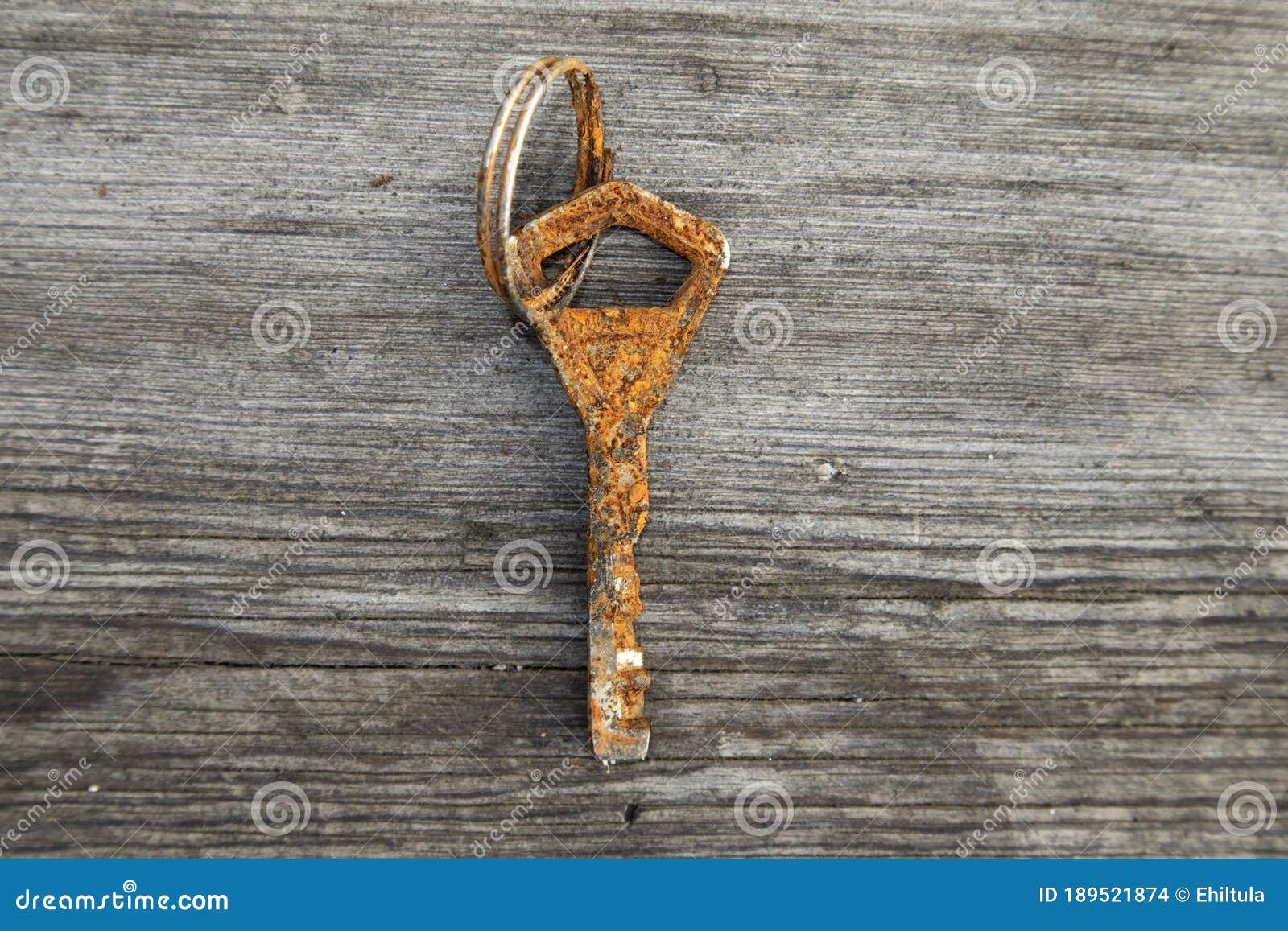 Corroded old key on ground stock photo. Image of dirty - 189521874