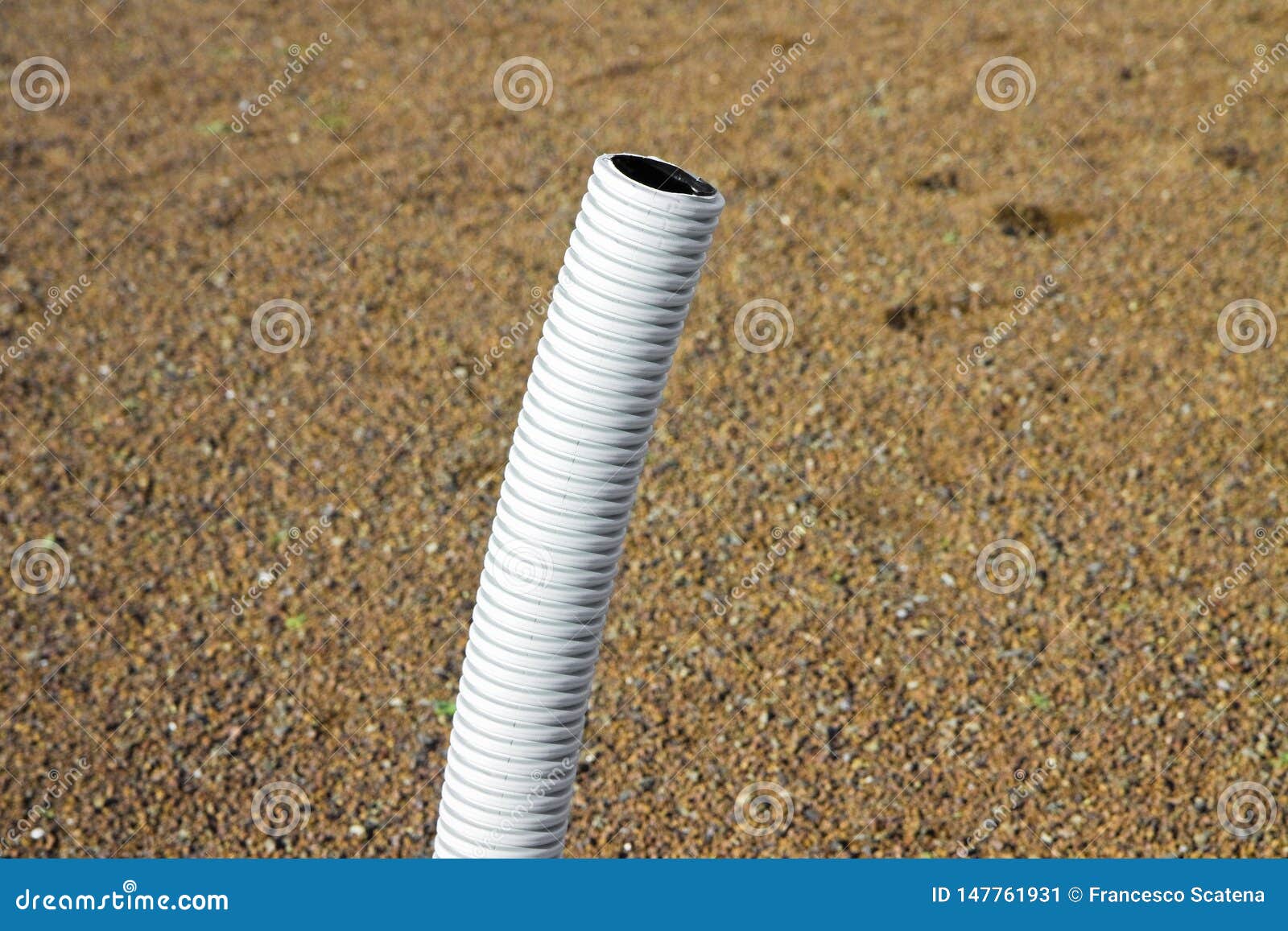 Corrugated Pipe with Cable Coming Out from the Ground Stock Image ...