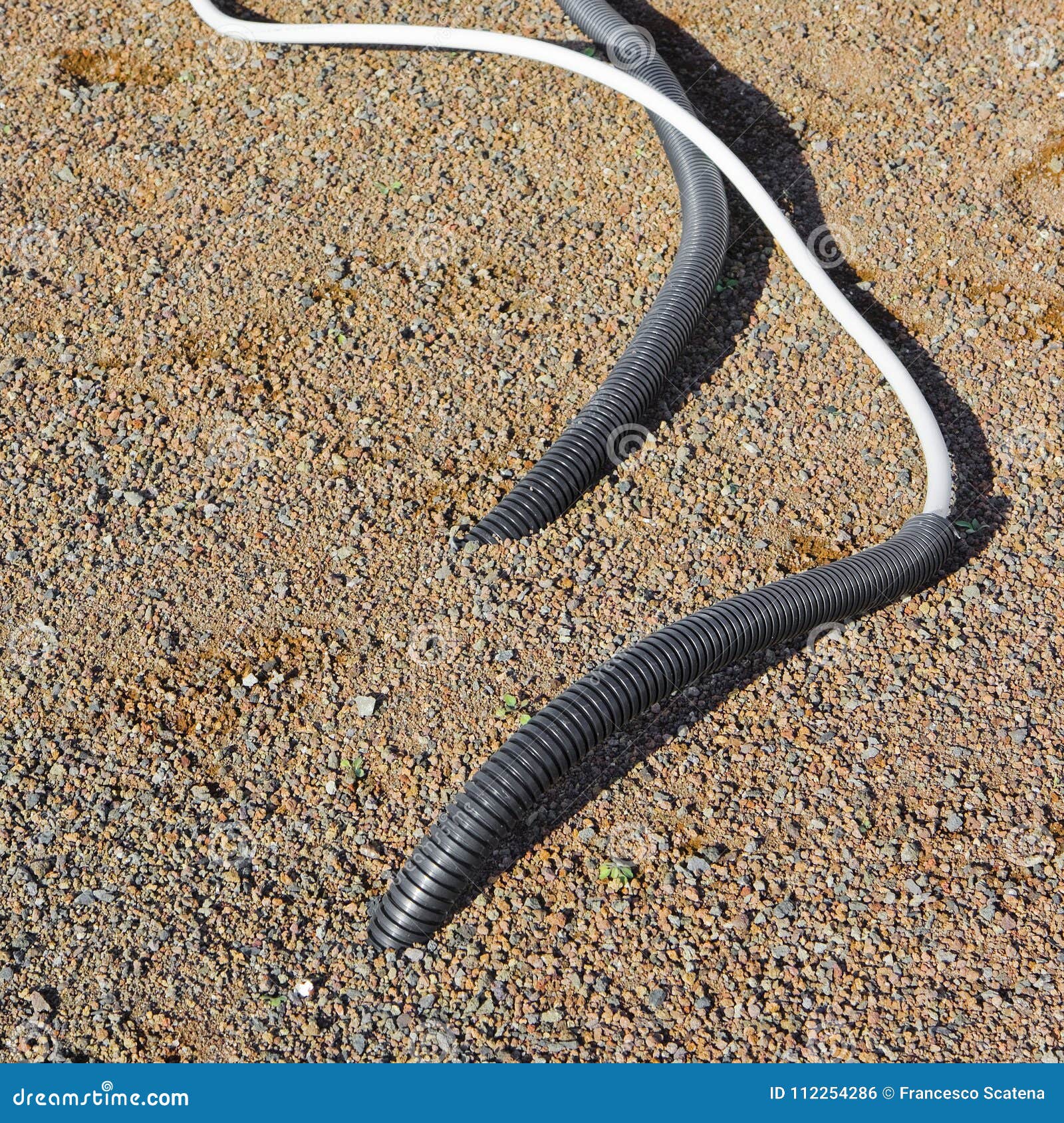 Corrugated Pipe with Cable Coming Out from the Ground Stock Photo ...