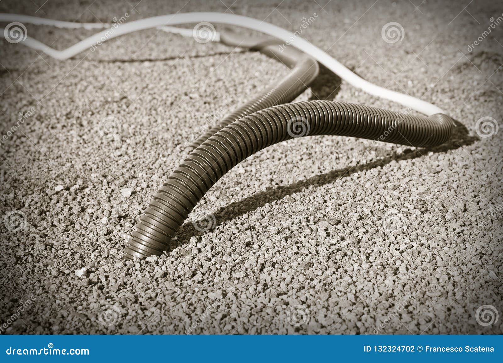 Corrugated Pipe with Cable Coming Out from the Ground Stock Photo ...