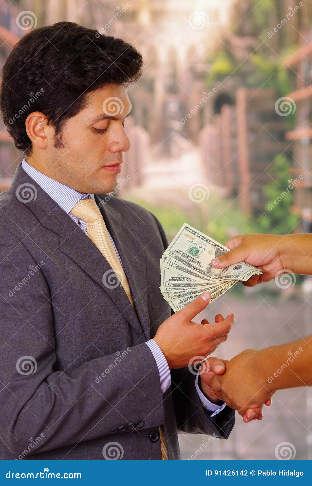 Corrupted Young Businessman Accepting Some Money from a Crook Stock ...