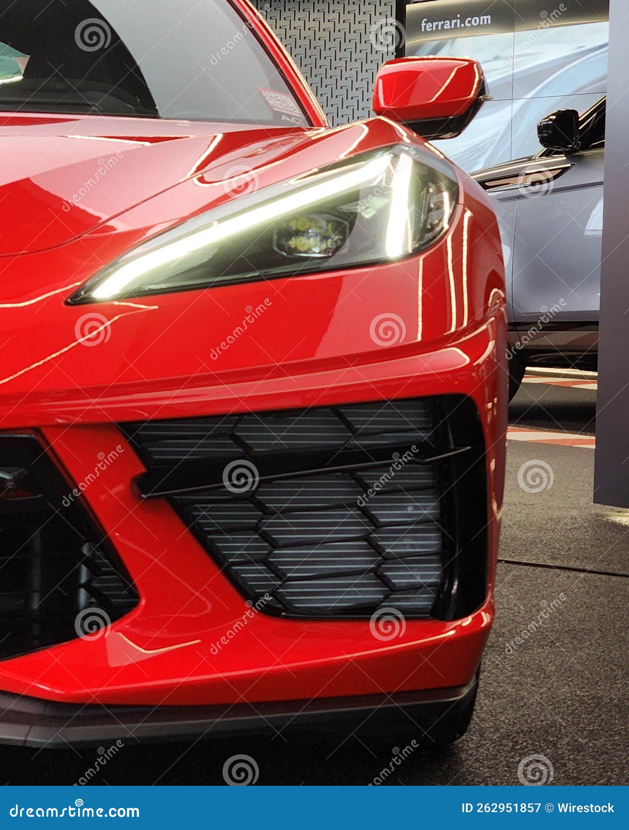 A Front View of the Beautiful Corvette C8 in Red with Headlight on at ...