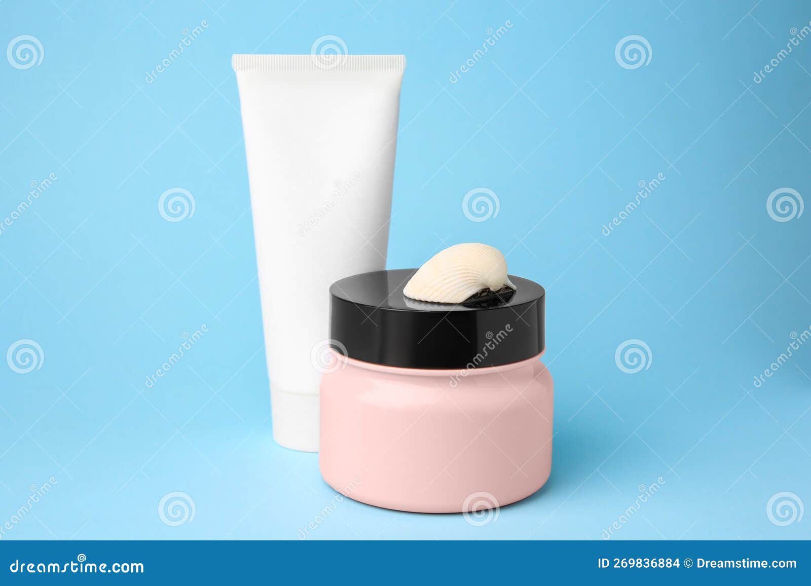 Cosmetic Products and Shell on Light Blue Background Stock Photo ...