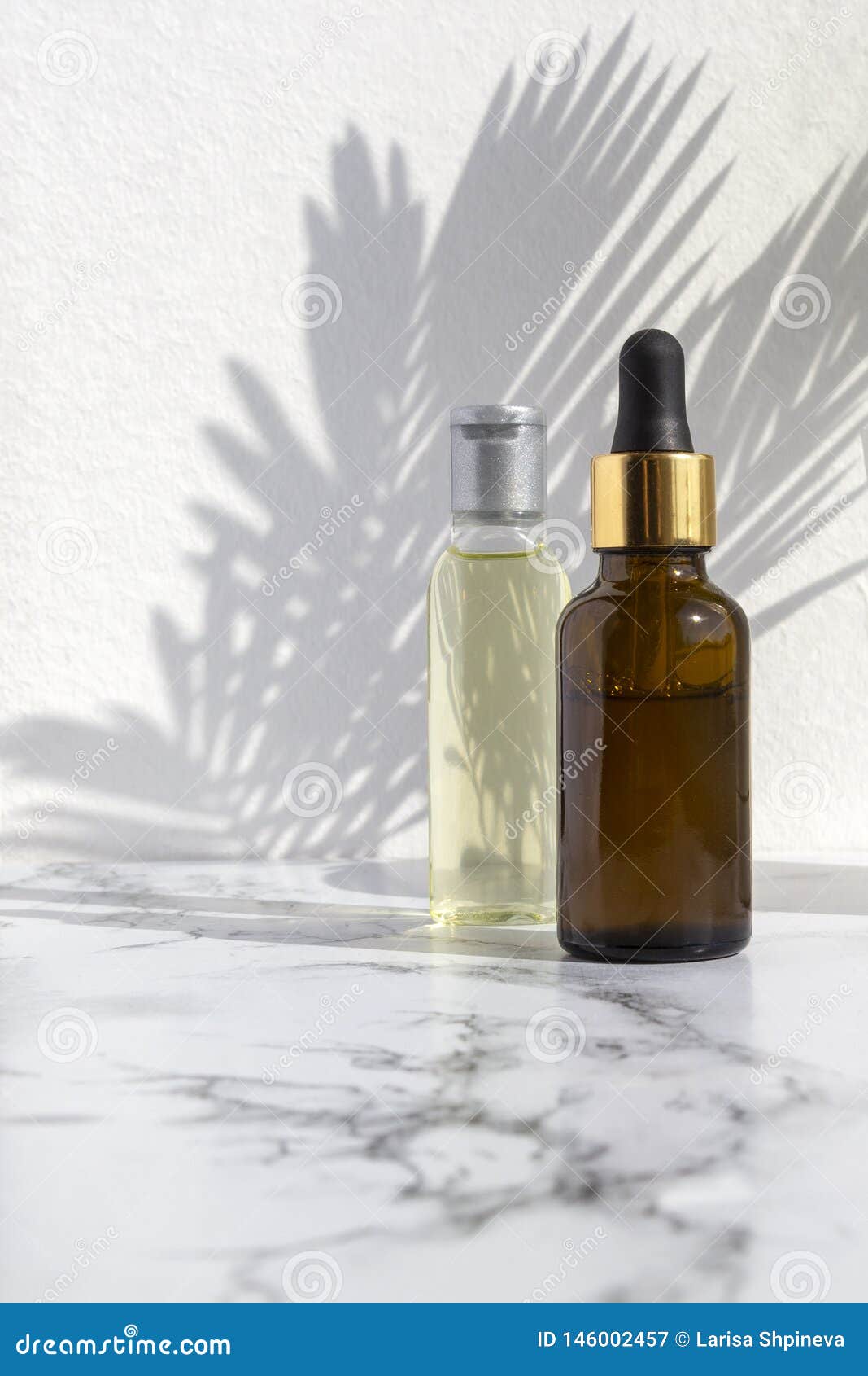 Cosmetic Skincare Products On Marble Background With Palm Leaves Shadow