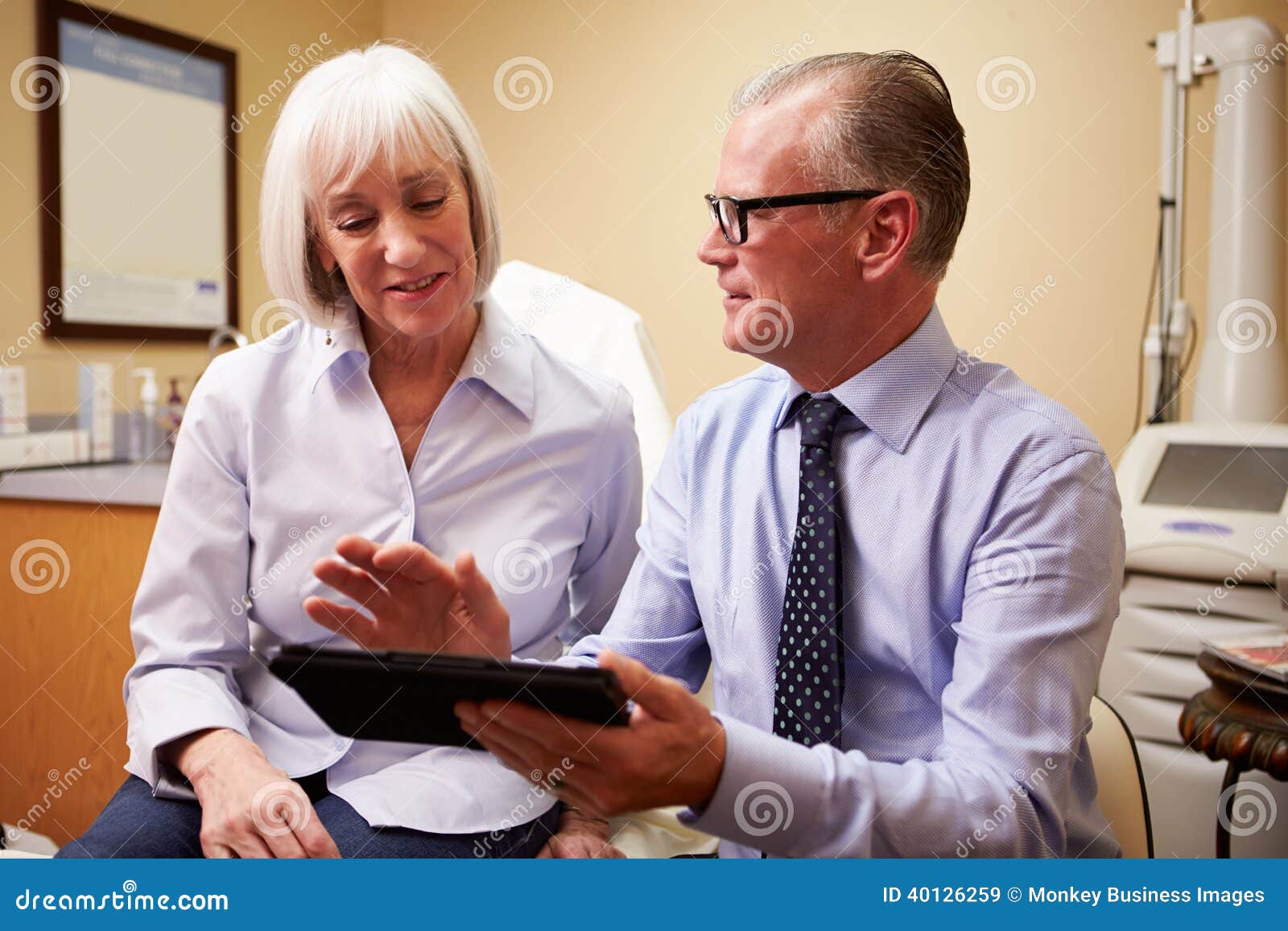 Cosmetic Surgeon Discussing Procedure with Client in Office Stock Image ...