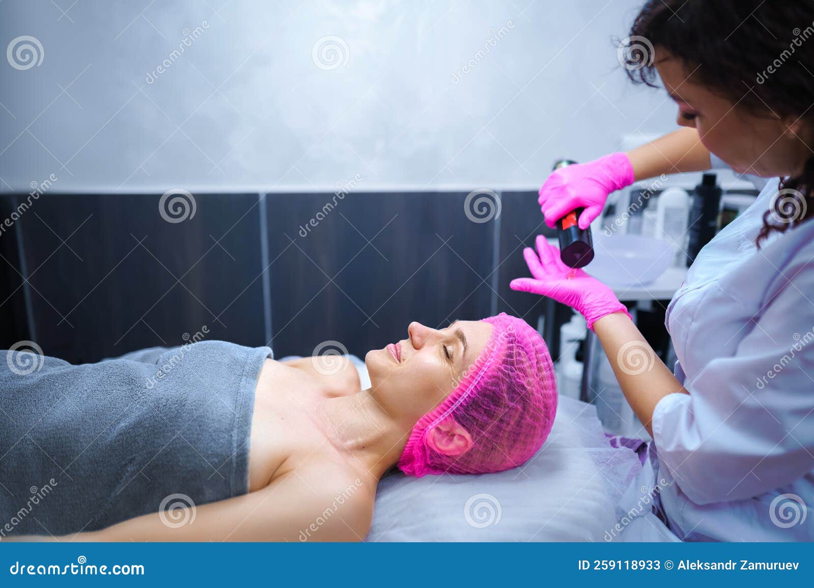 Cosmetologist Applies Cream On The Skin Of The Client Stock Image