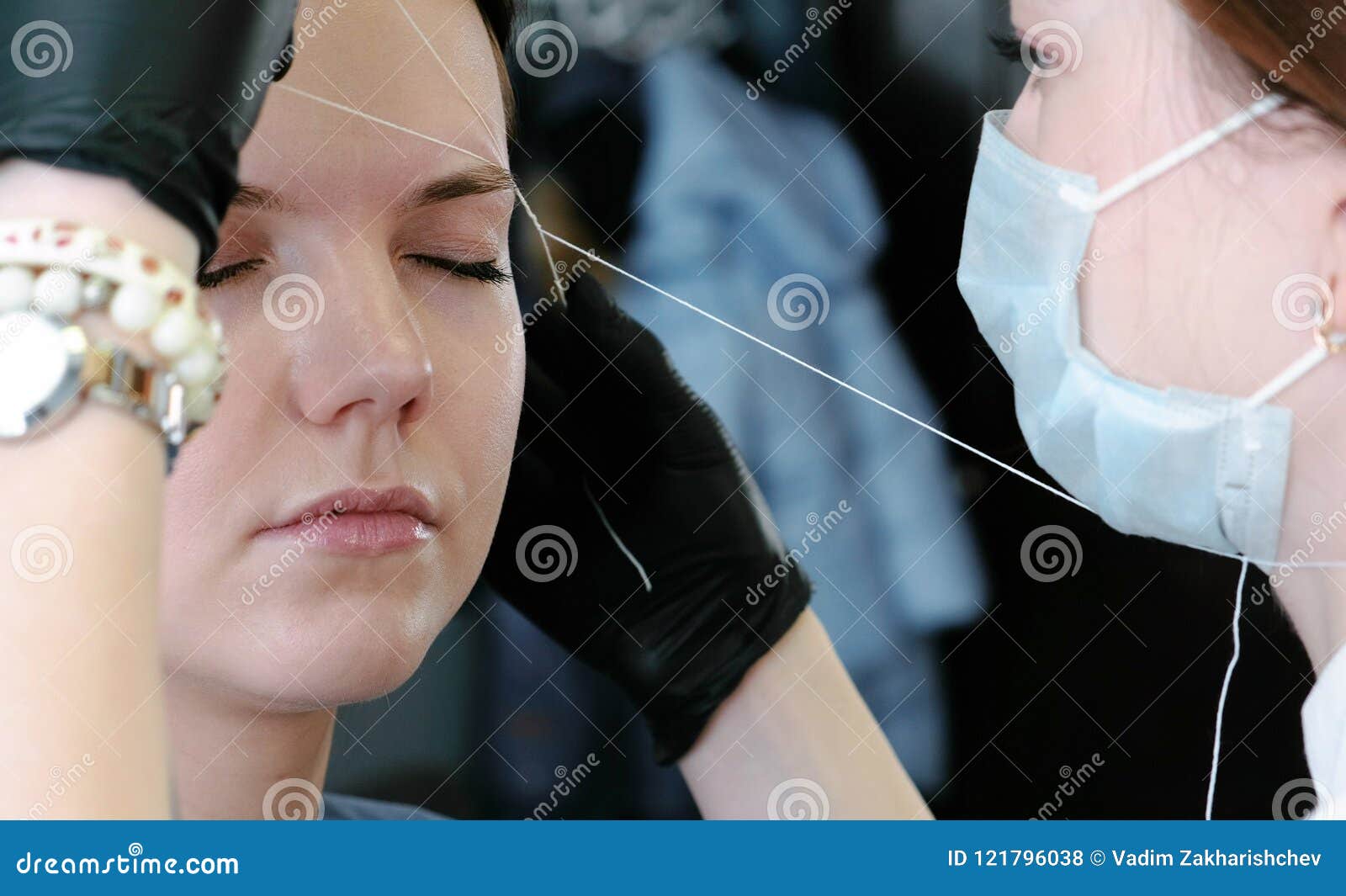 Cosmetologist Performs the Procedure of Correction Eyebrow Threading ...