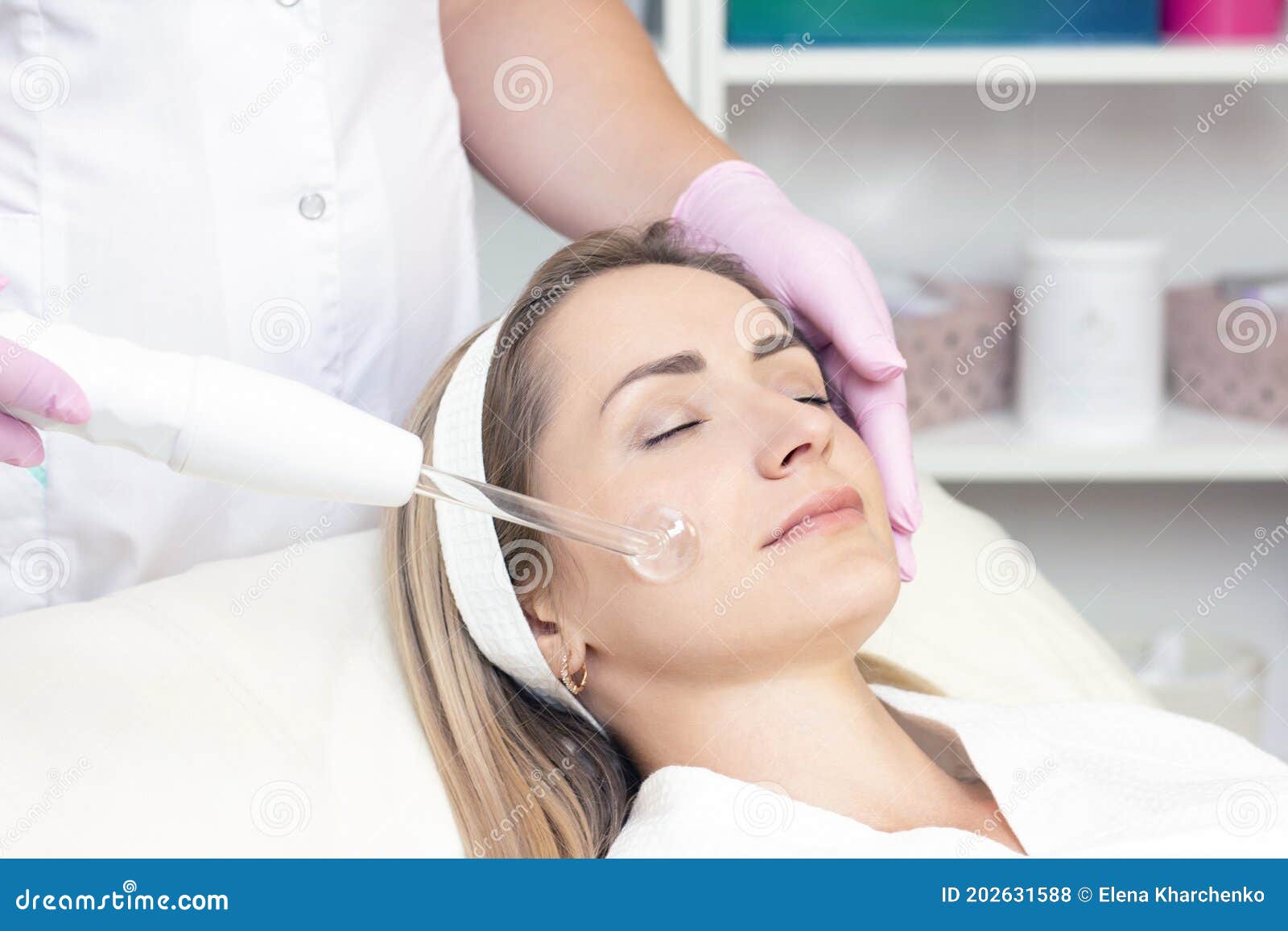 Cosmetologist Performs a Pulse Current Procedure Stock Photo - Image of ...