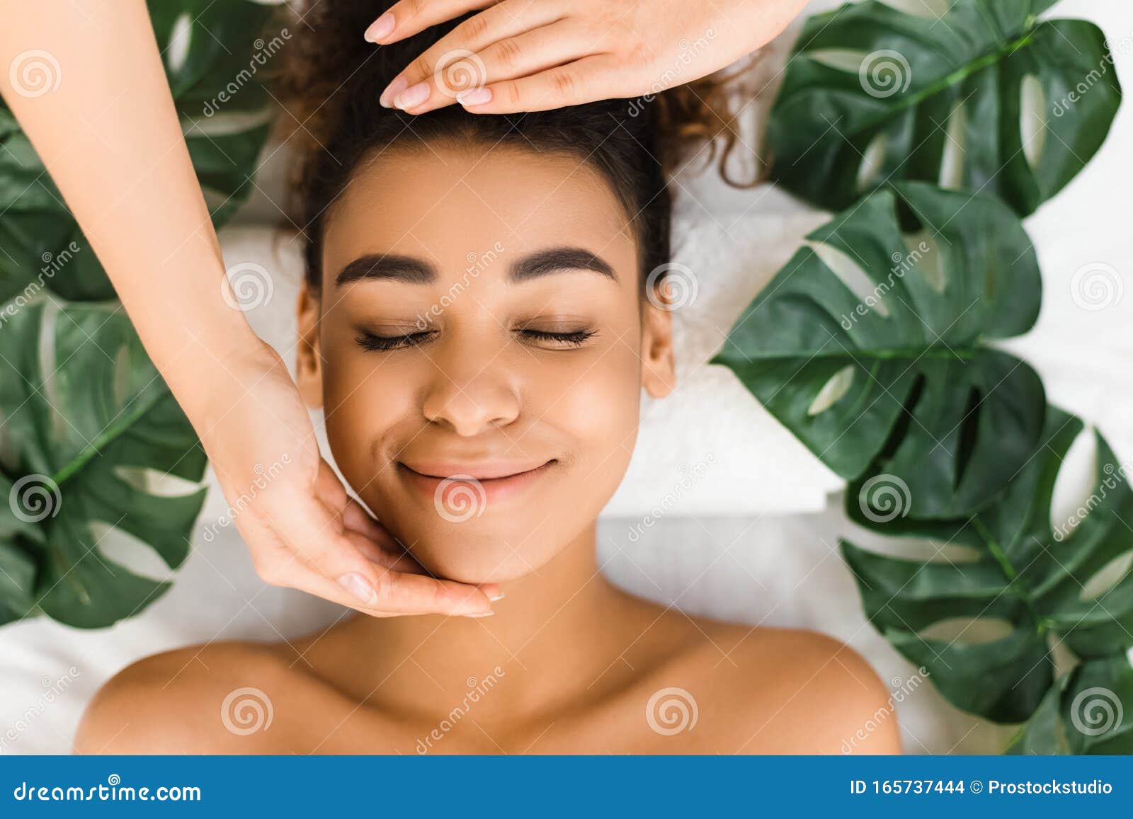 Cosmetology Concept. Afro Girl Getting Facial Massage Stock Photo ... Cosmetology Concept. Afro Girl Getting Facial Massage Stock Photo ...