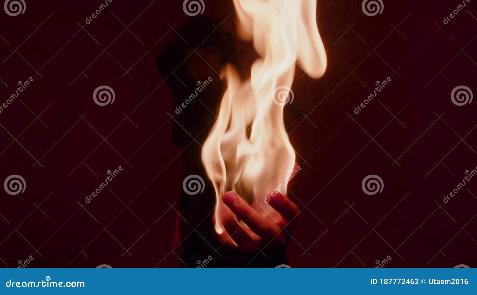 Cosplay Wizard with a Sword Behind His Back, Burning Hand. Real Fire on ...