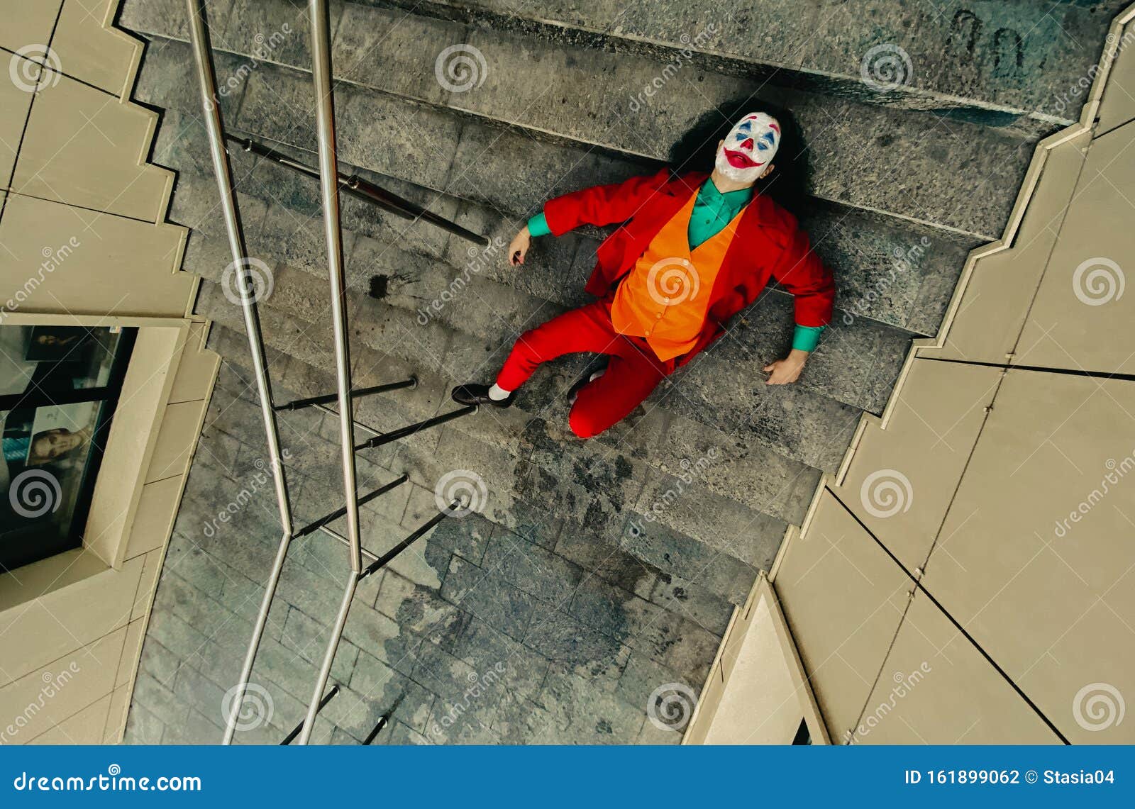 Cosplayer in the Image of a Crazy Clown Runs Down the Stairs Stock ...