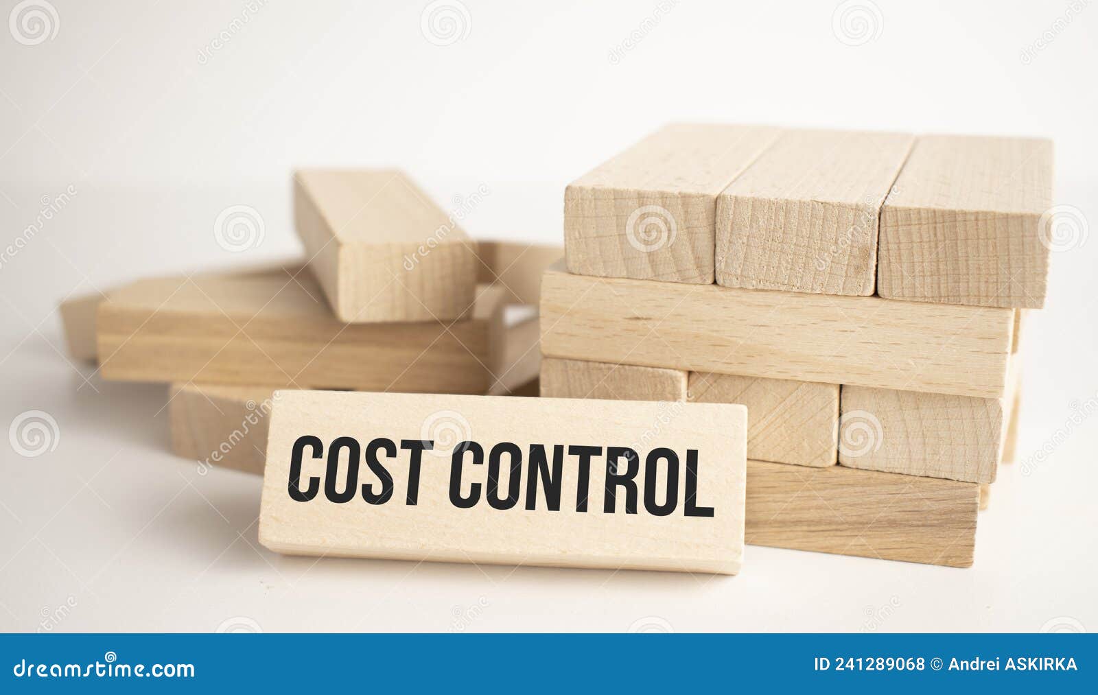 The COST CONTROL Text is Written on One of the Many Scattered Wooden ...