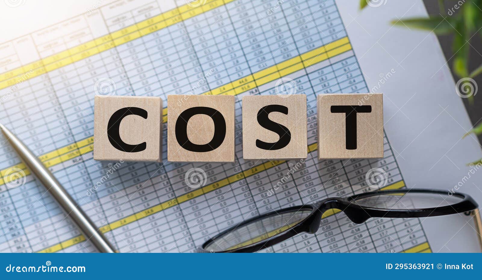 Cost - Word Concept from Wooden Blocks on Blue Background Stock Image ...