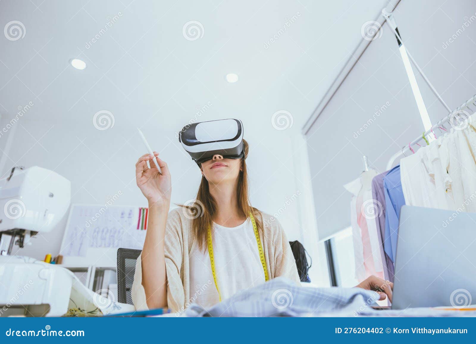 A Costume Designer Or Stylist Helps A Model Prepare For A Photo Shoot ...