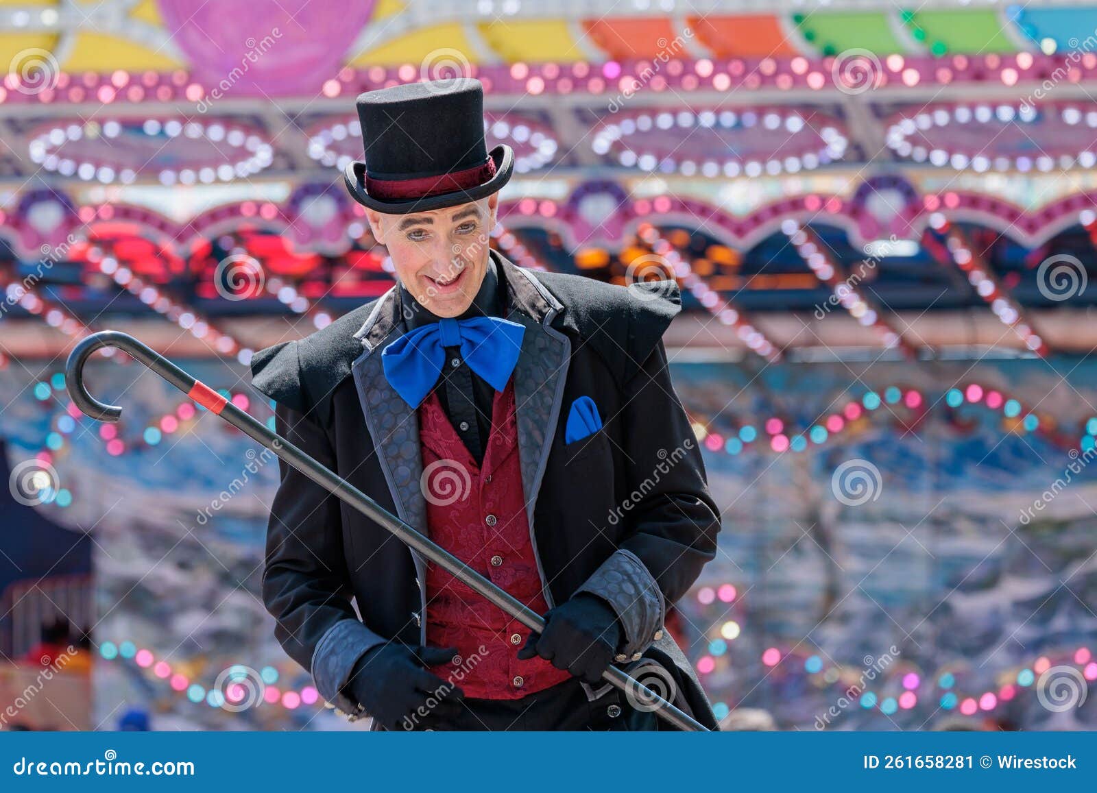 Costumed Carnival Performer on Stilts Welcomes the Crowd in an ... Costumed Carnival Performer on Stilts Welcomes the Crowd in an ...