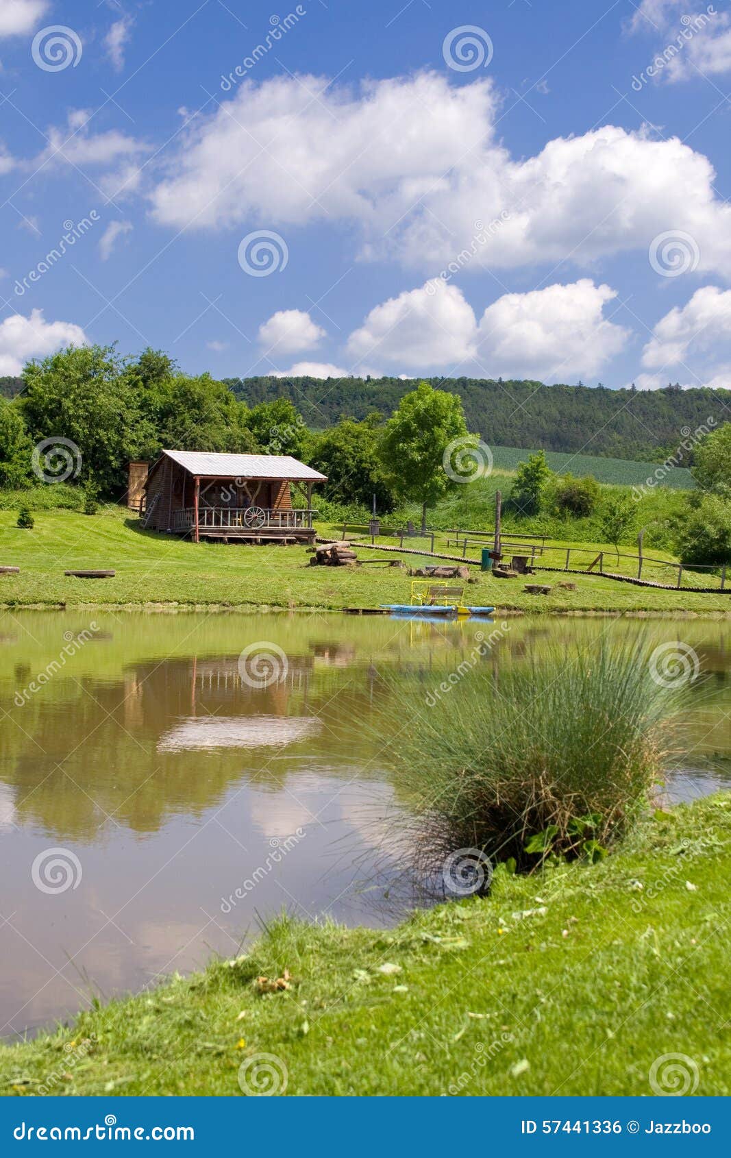 Cottage at a pond stock photo. Image of blue, forrest - 57441336