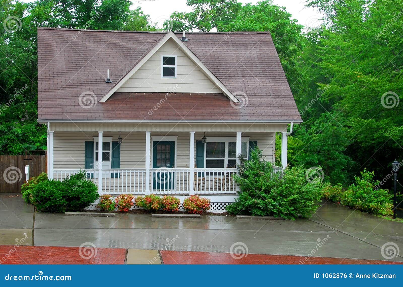 Cottage in the Rain stock photo. Image of portico, landscaping - 1062876