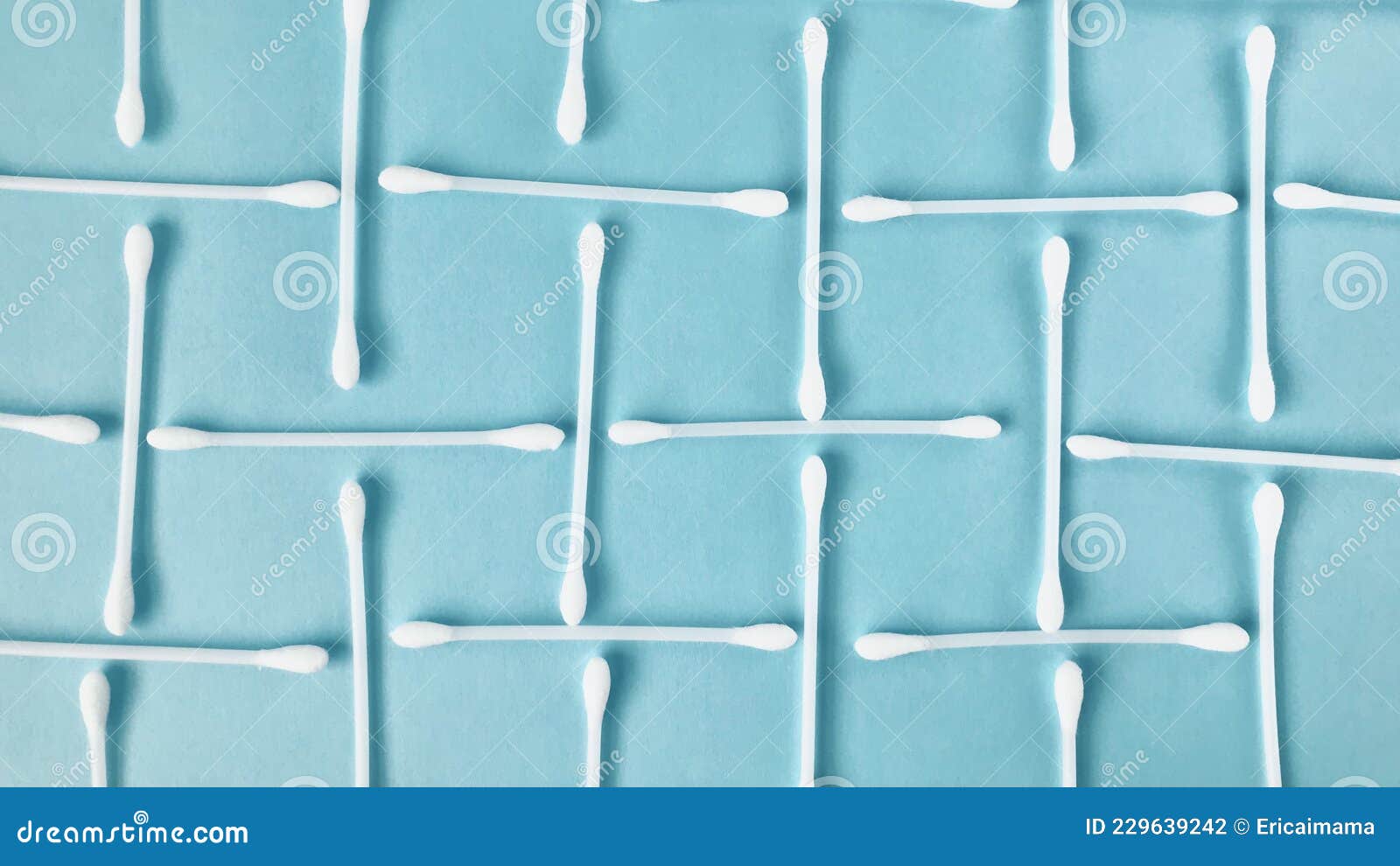 Cotton Buds Arranged Randomly and Crossed into Squares on a Blue ...
