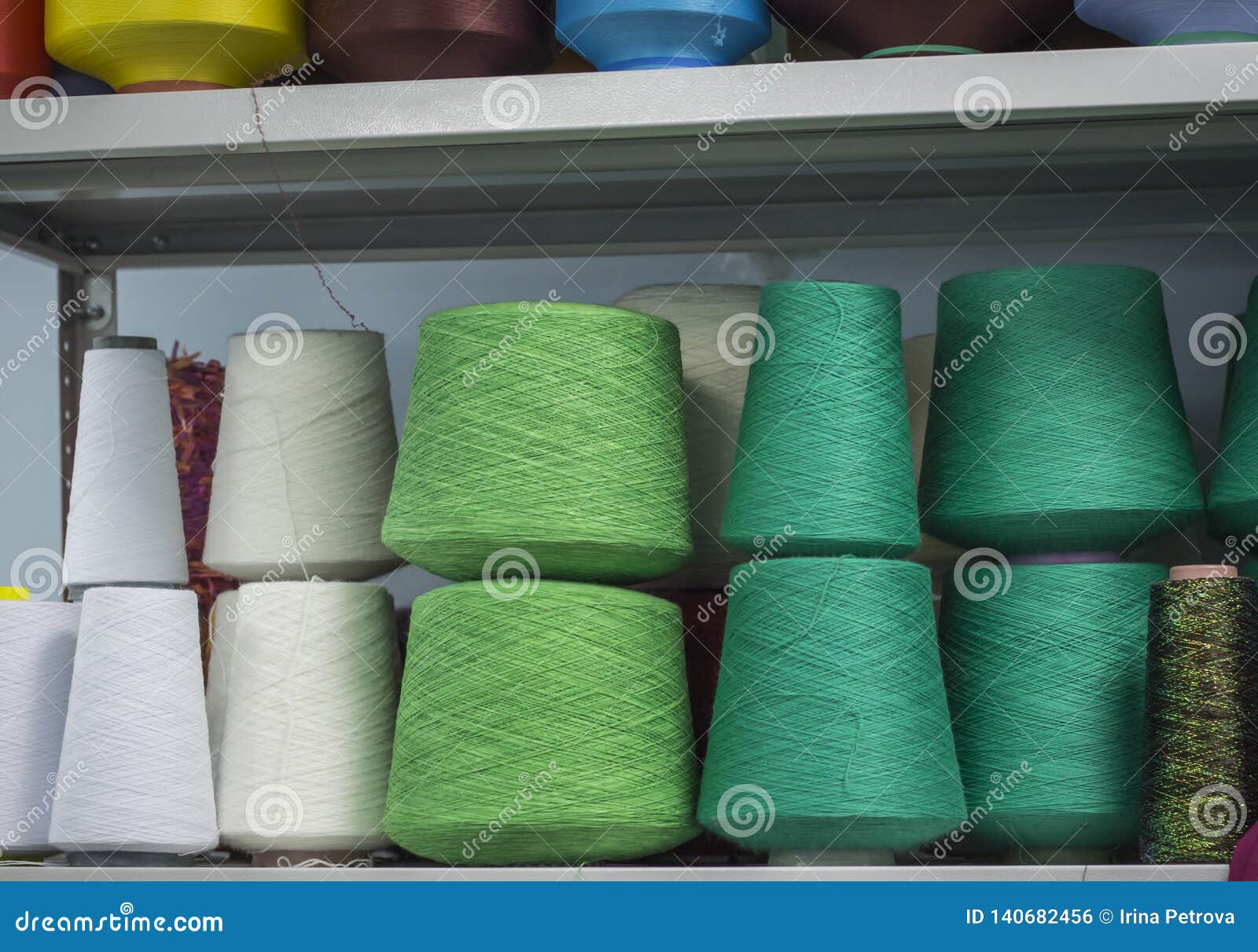 Cotton and Wool Yarn on the Spools on the Shelf in the Production Stock ...