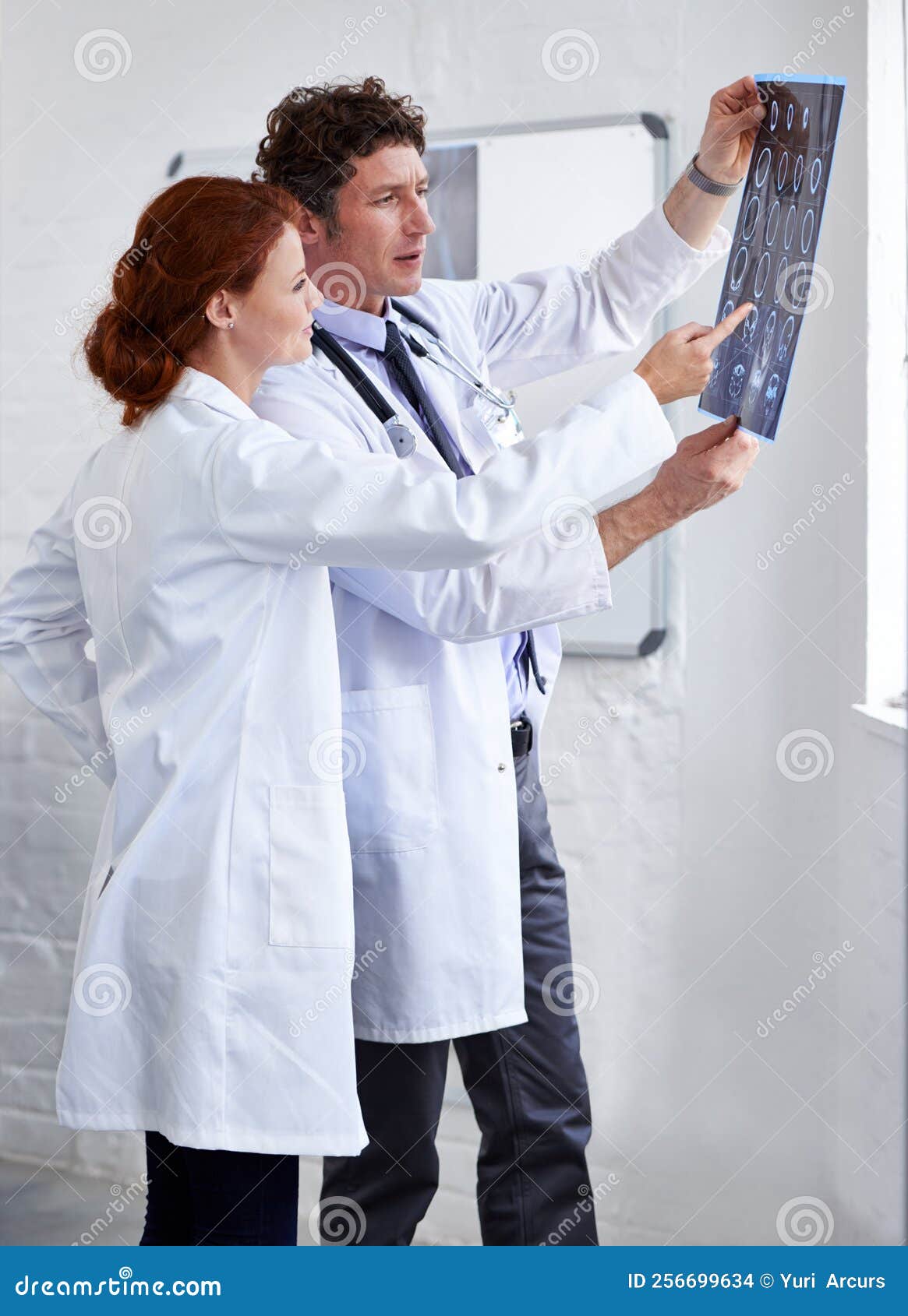 This Could Be Serious. Two Doctors Assessing a Patients X-ray at the ...