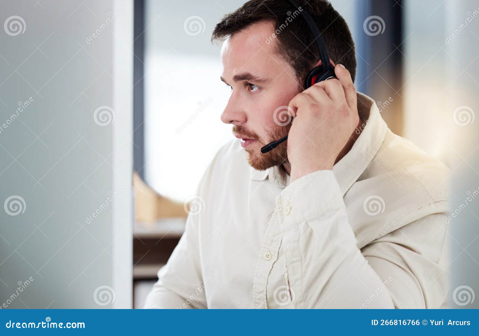 Could You Repeat that. a Handsome Young Call Centre Agent Sitting Alone ...