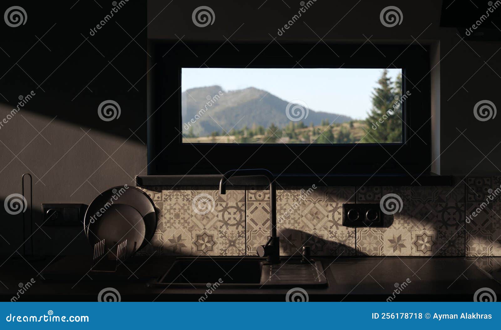 Counter Top of Modern Kitchen with Black Utensils with Mountain View ...