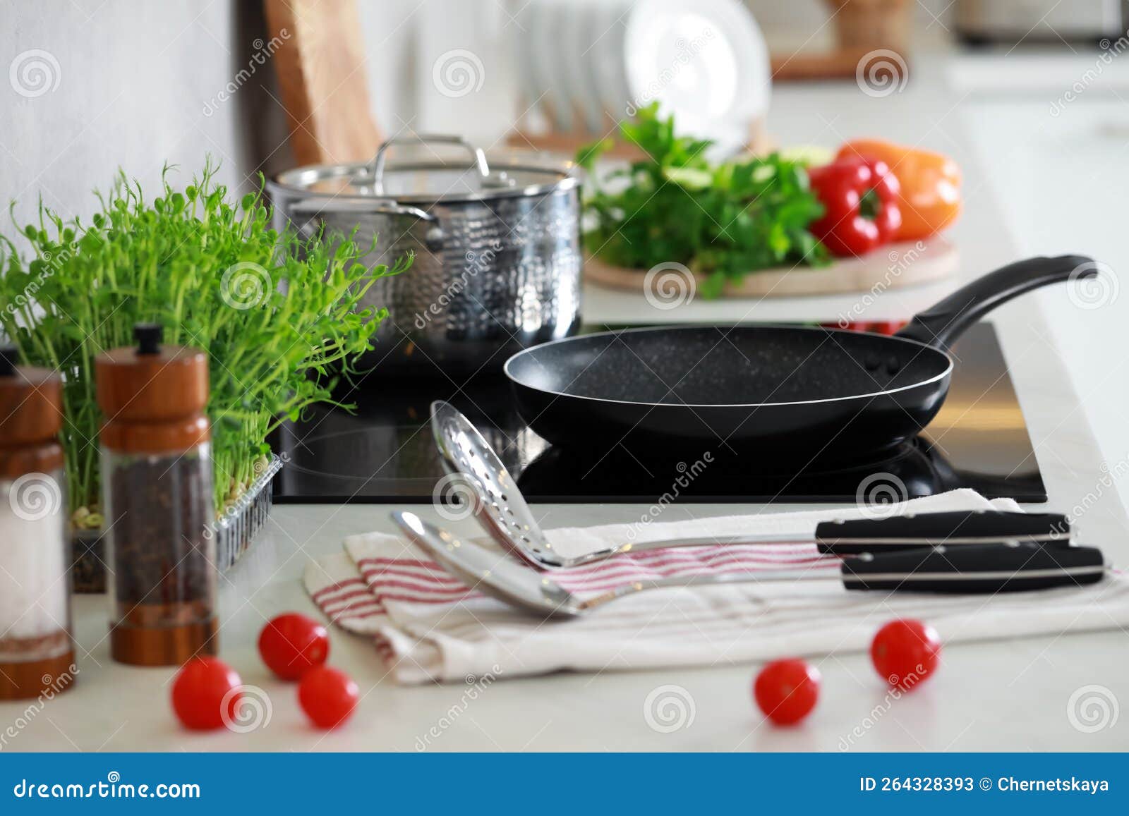 Countertop with Different Cooking Utensils and Vegetables in Kitchen ...