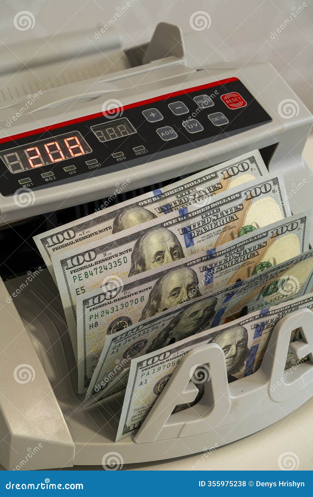 Counting Cash with a Currency Counting Machine in a Business Setting ...