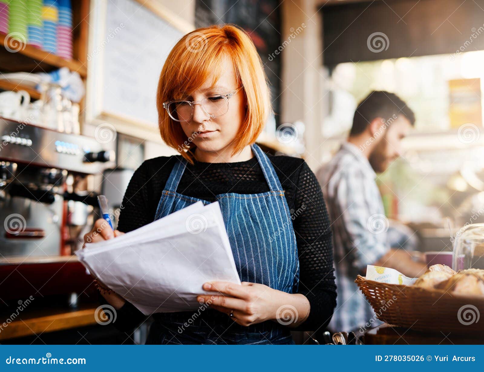 Counting Her Stock. a Shop Owner Doing Some Paperwork. Stock Photo ...