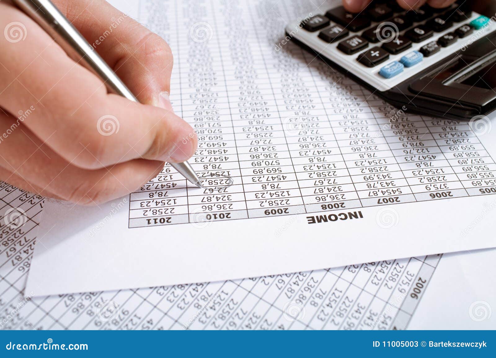 Counting income in 2010 stock image. Image of holding - 11005003