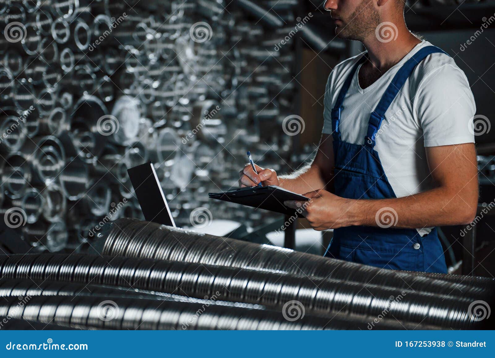 Counting Objects. Man in Uniform Works on the Production Stock Photo ...