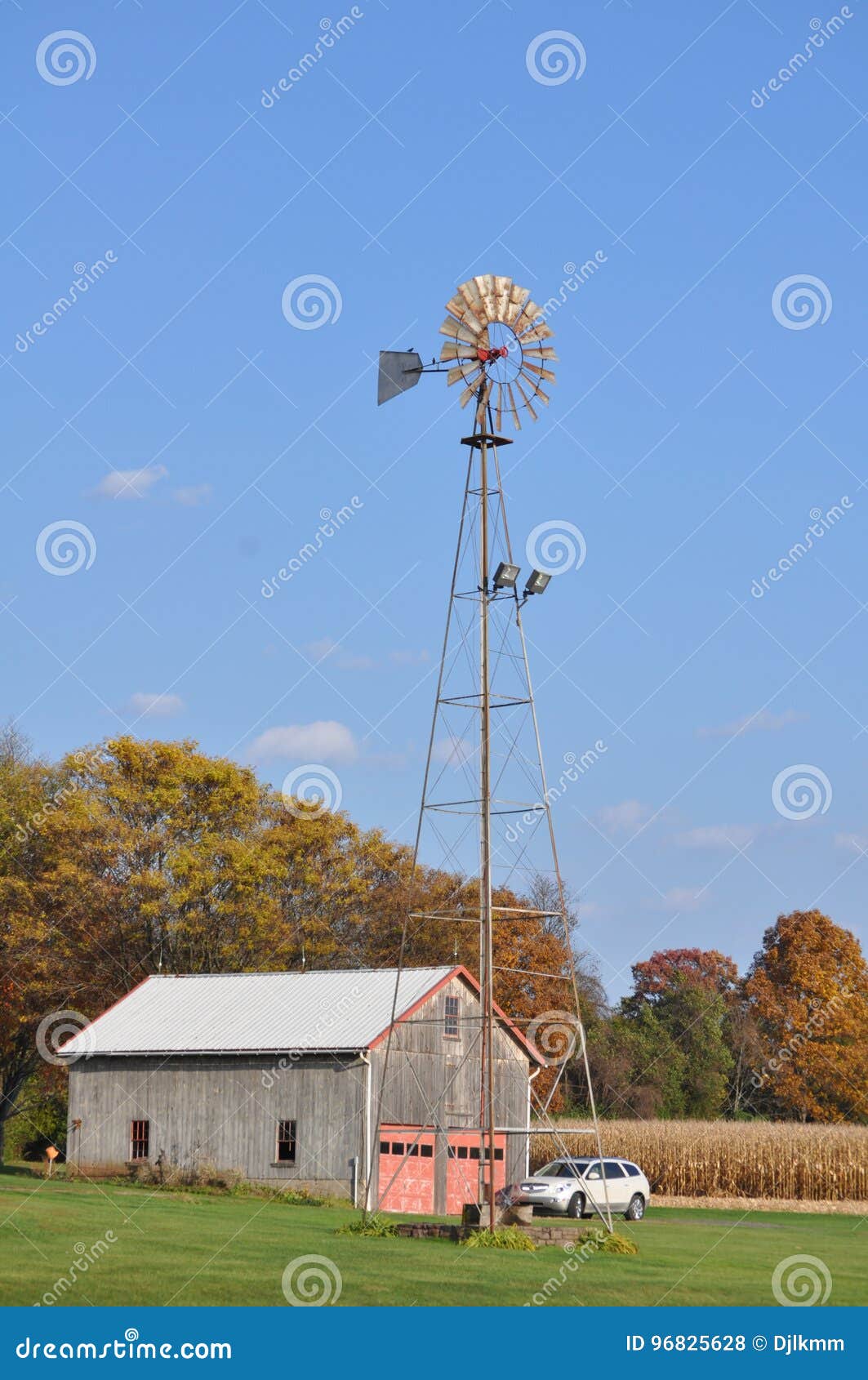 Country Barn in the Fall with Windmill Stock Photo - Image of setting ...