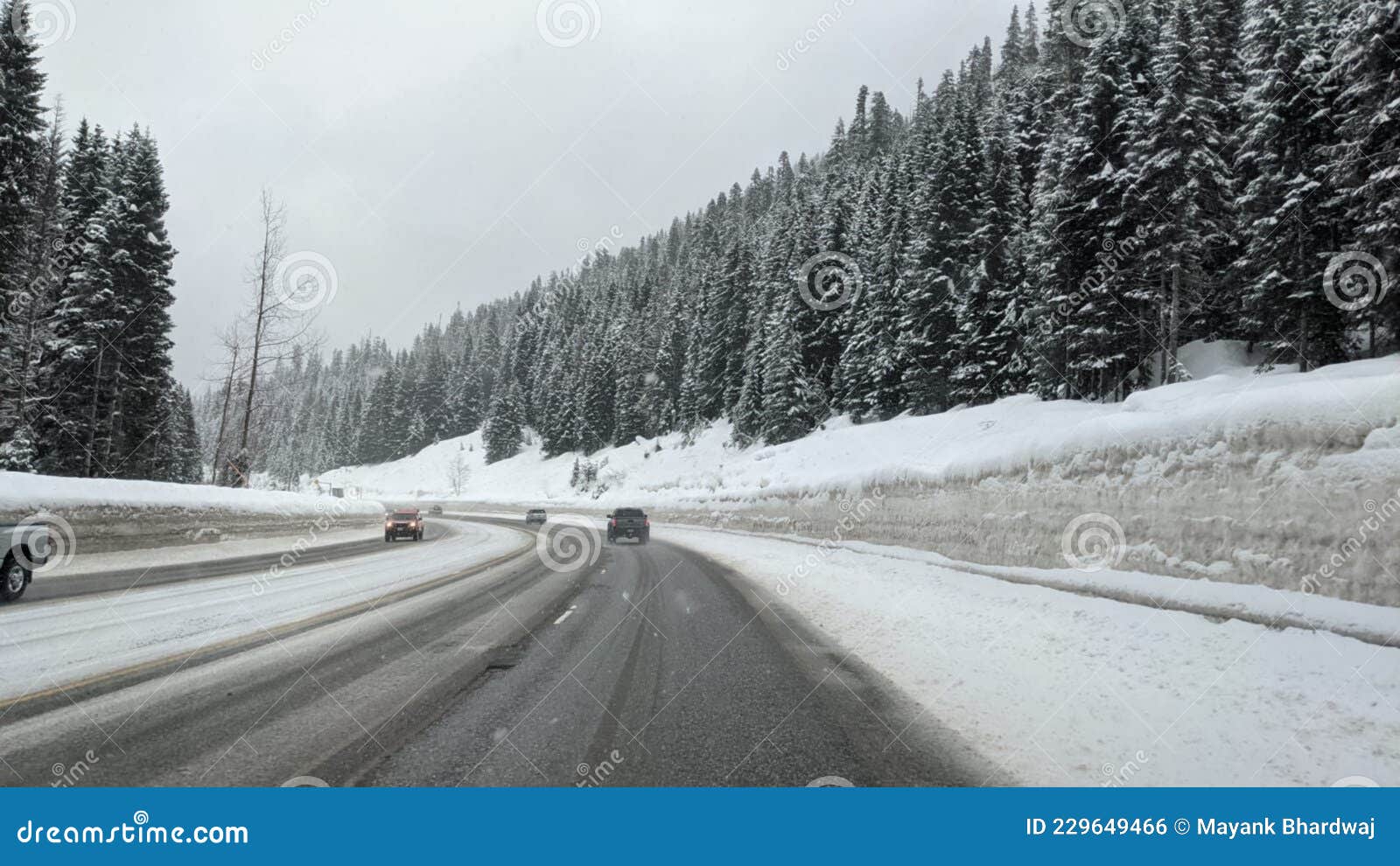 The Country Road with Snowy Mountains by the Roadside Stock Photo ...