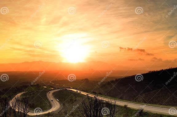 Country road during sunset stock image. Image of bend - 5149713