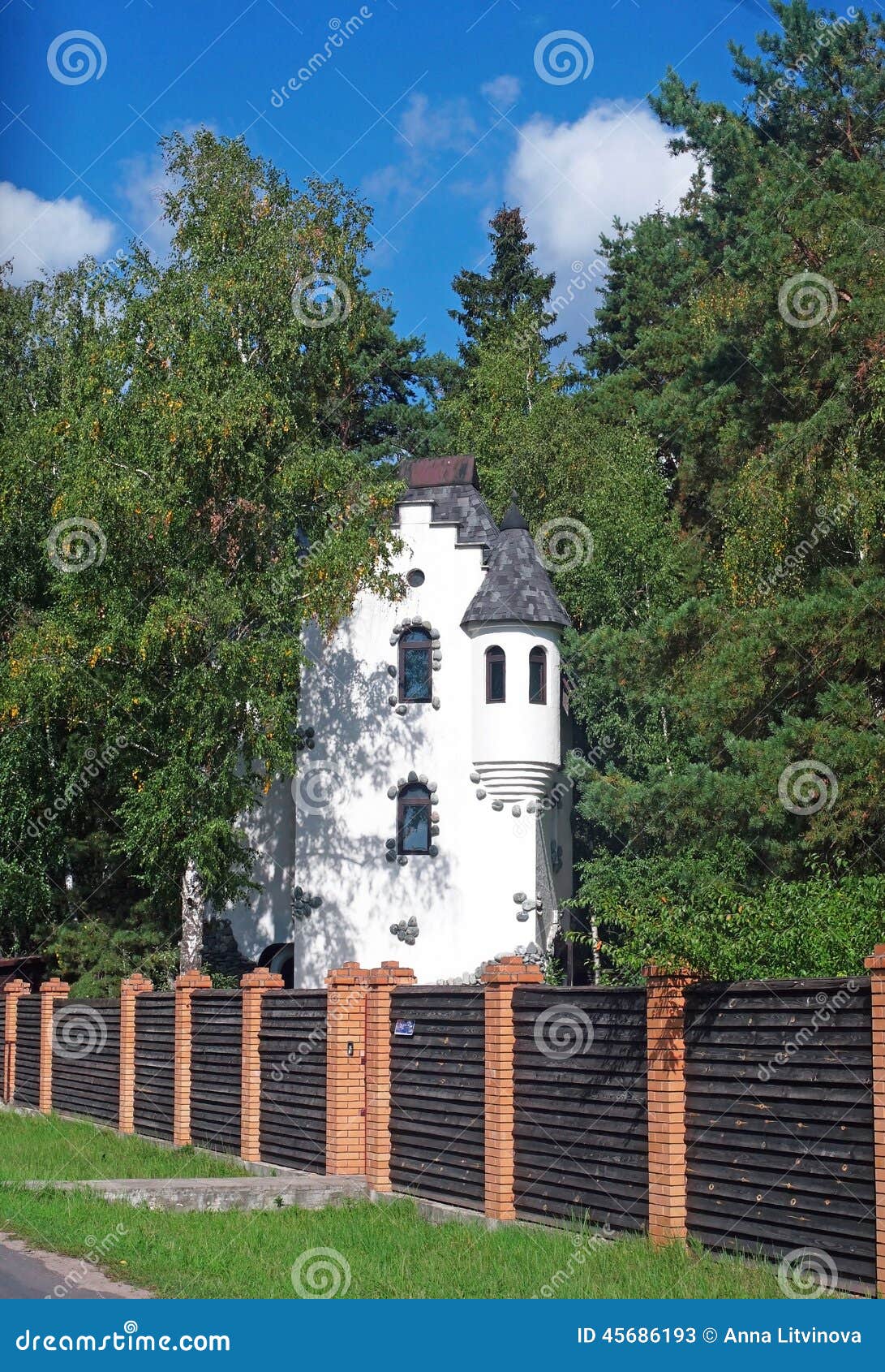 A Country White Cottage in the Form of a Tower in the Trees Stock Image ...