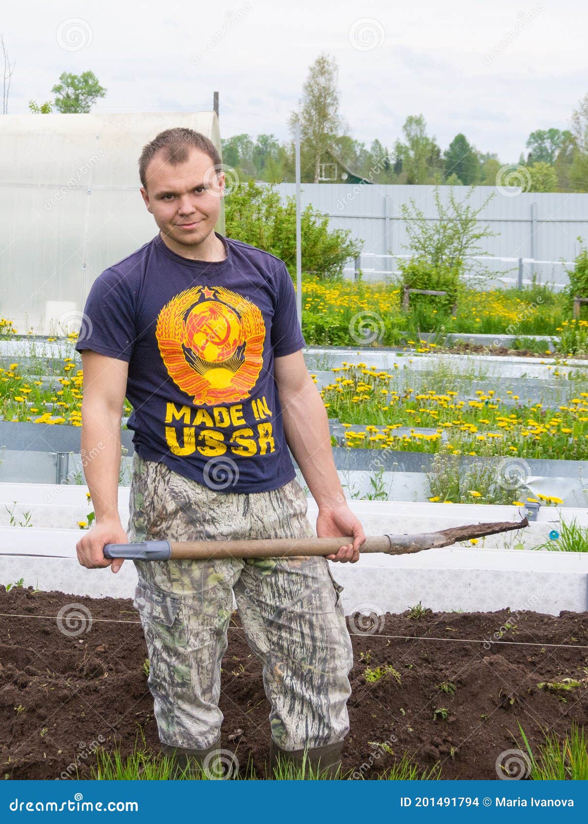 Country of Work. in the Country, a Young Man Cultivates the Land. Stock ...
