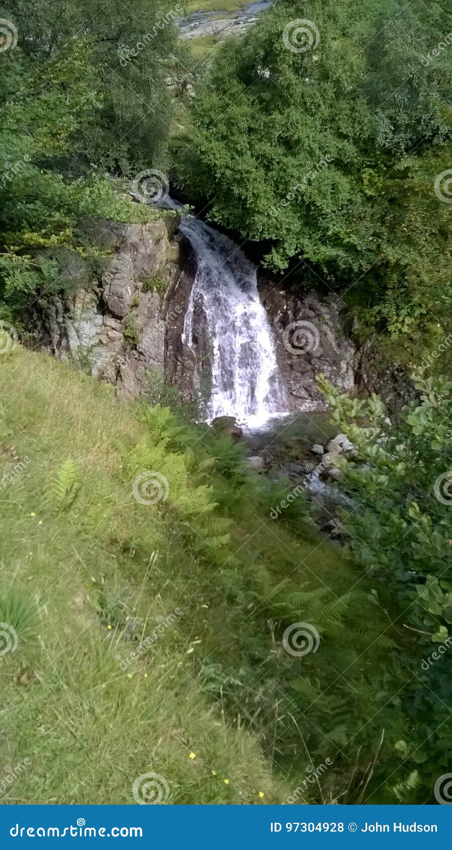 Countryside Waterfall Cascades Over Rocks Set among Tree Lined River ...