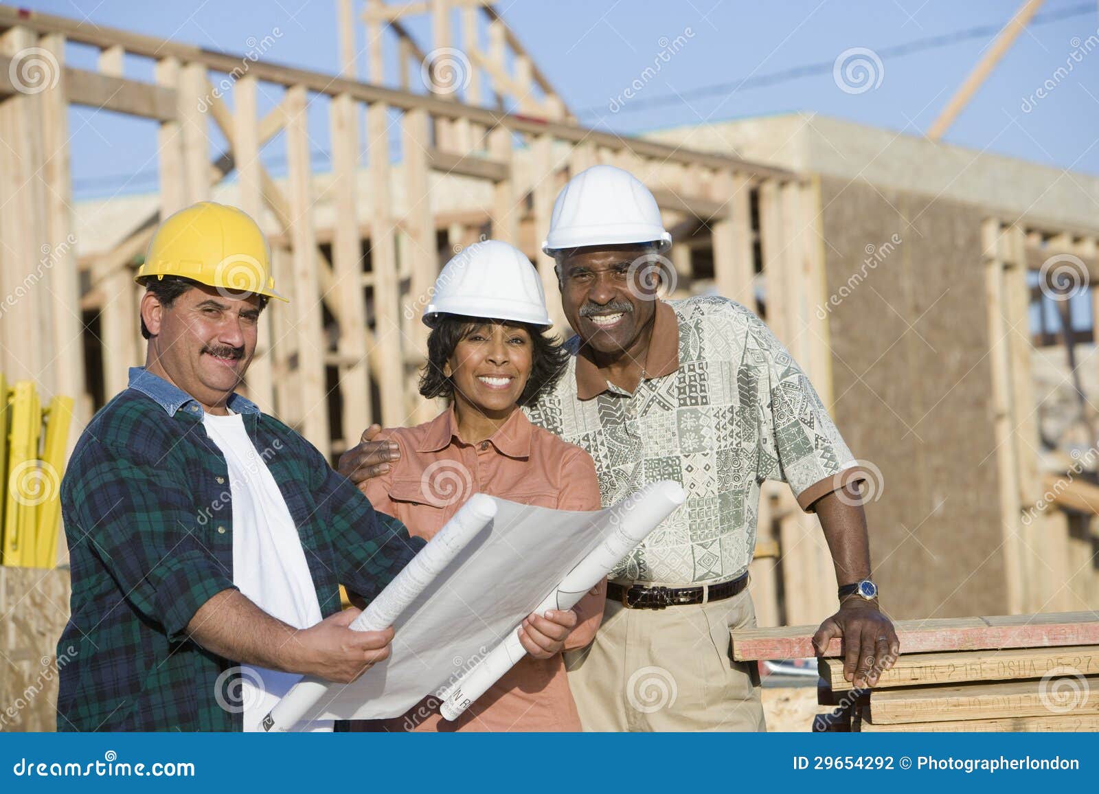 Couple and Architect in Front of Incomplete House Stock Photo - Image ...