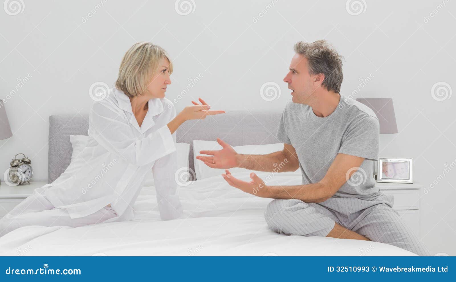 Couple arguing in bedroom stock image. Image of distance - 32510993