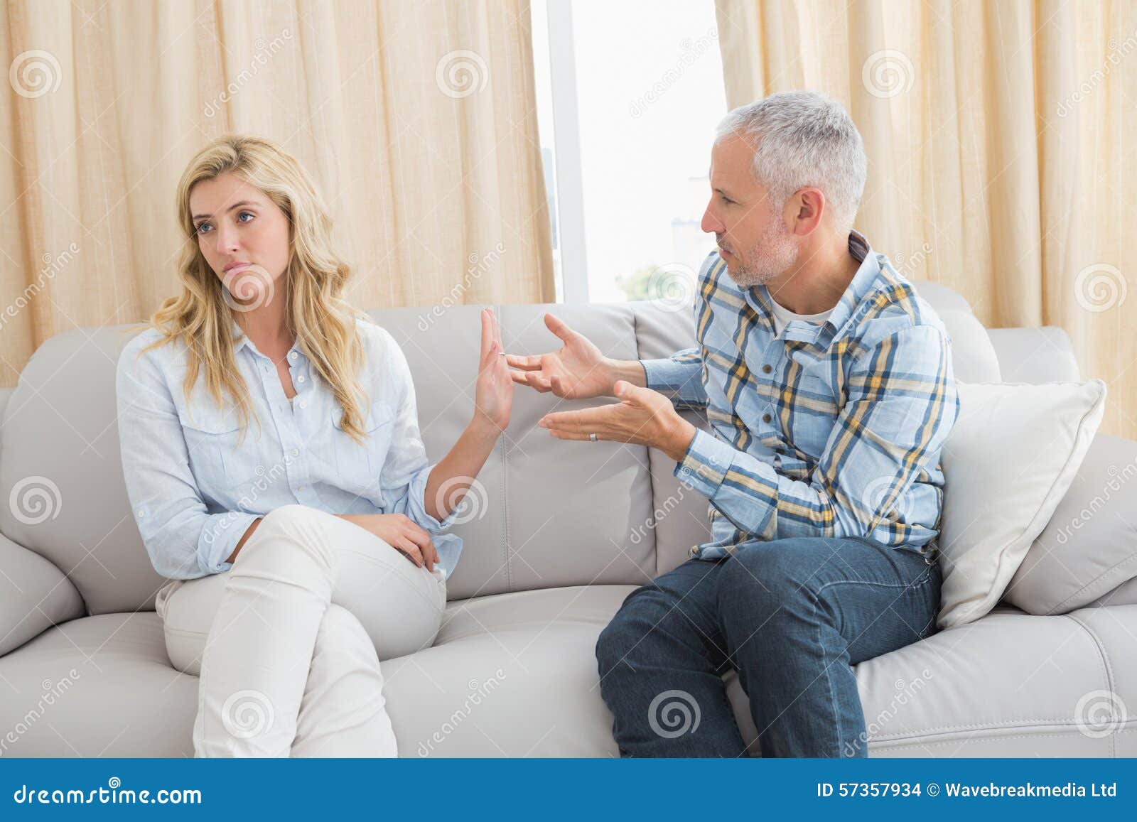 Couple Arguing on the Couch Stock Photo - Image of fighting, domestic ...