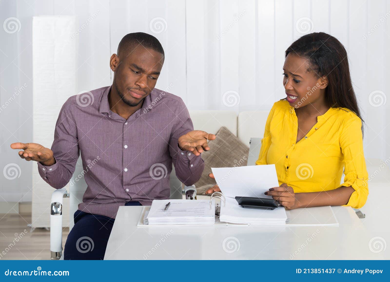 Couple Arguing Over Bill stock image. Image of financial - 213851437