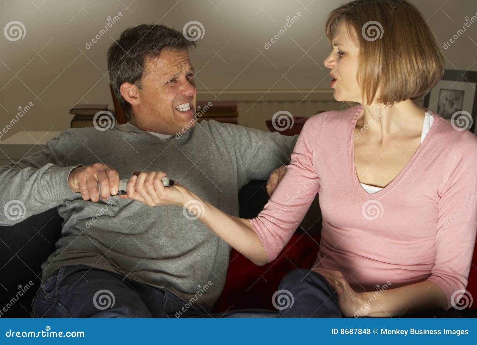 Couple Arguing Over Television Channel Stock Photo - Image of family ...