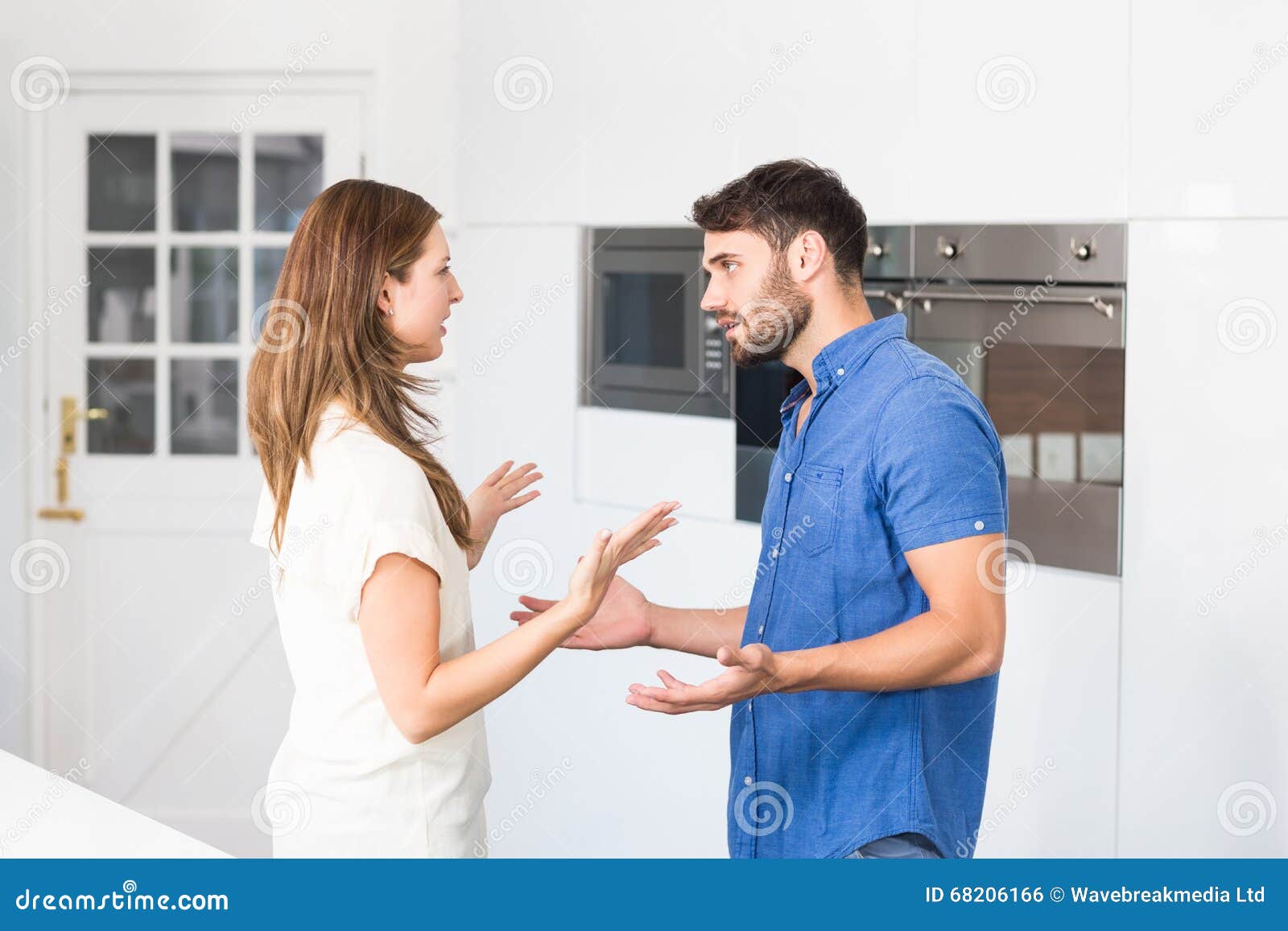 Couple Arguing while Standing in Kitchen Stock Photo - Image of adult ...
